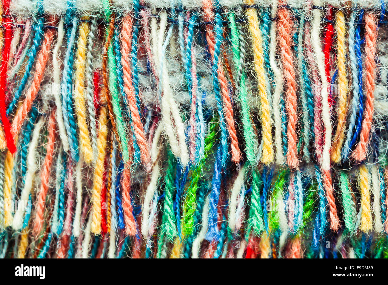Colorful fringe of a wool blanket Stock Photo - Alamy