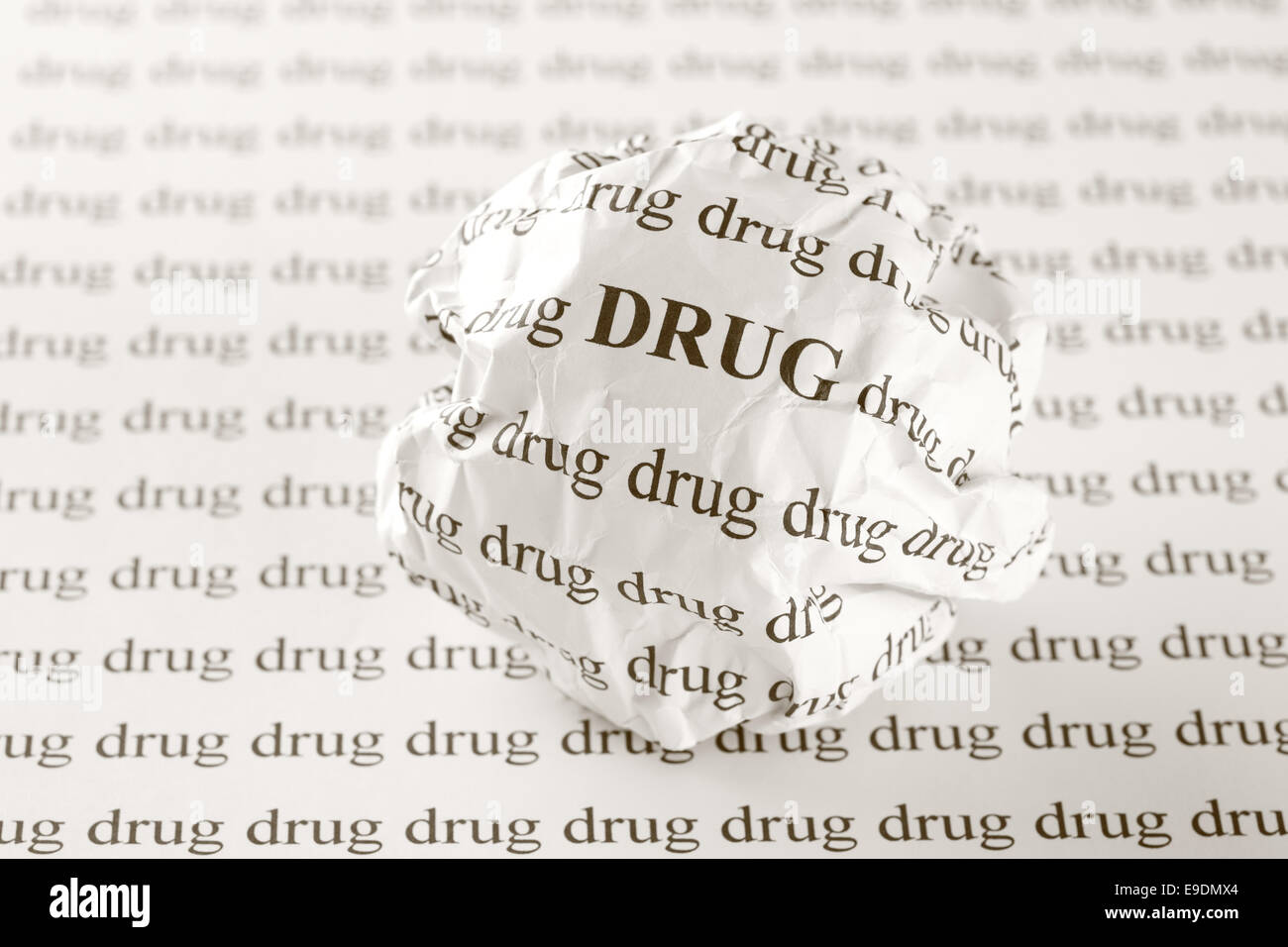 Crumpled paper ball with words "Drug". Sepia Stock Photo - Alamy