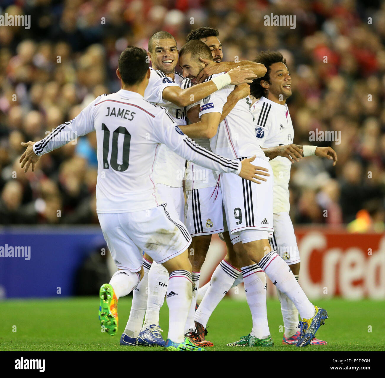 Liverpool, UK. 22nd Oct, 2014. Karim Benzema of Real Madrid is mobbed ...