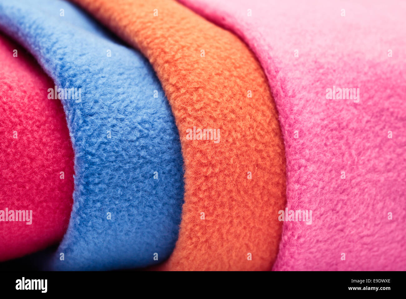 Stack of colorful fleece cloths Stock Photo - Alamy