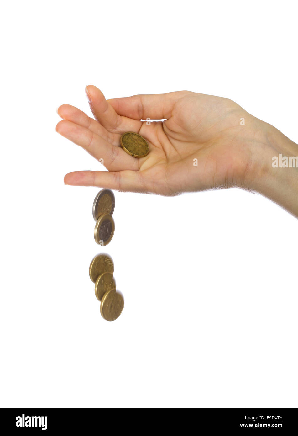Hand throwing gold and silver coins isolated over white background ...