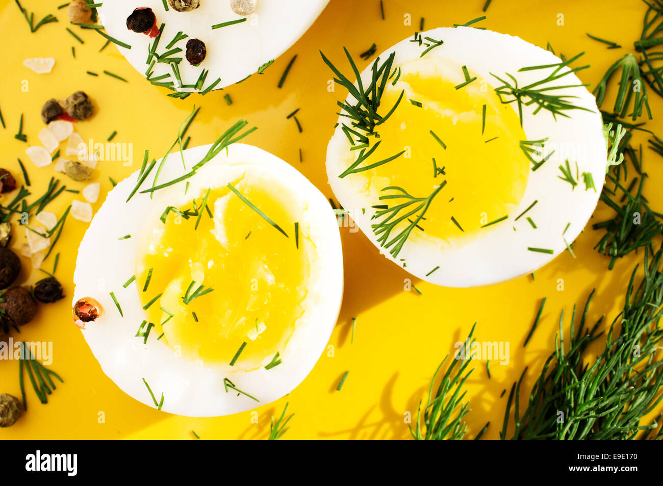 Boiled eggs with salt, pepper and dill Stock Photo - Alamy