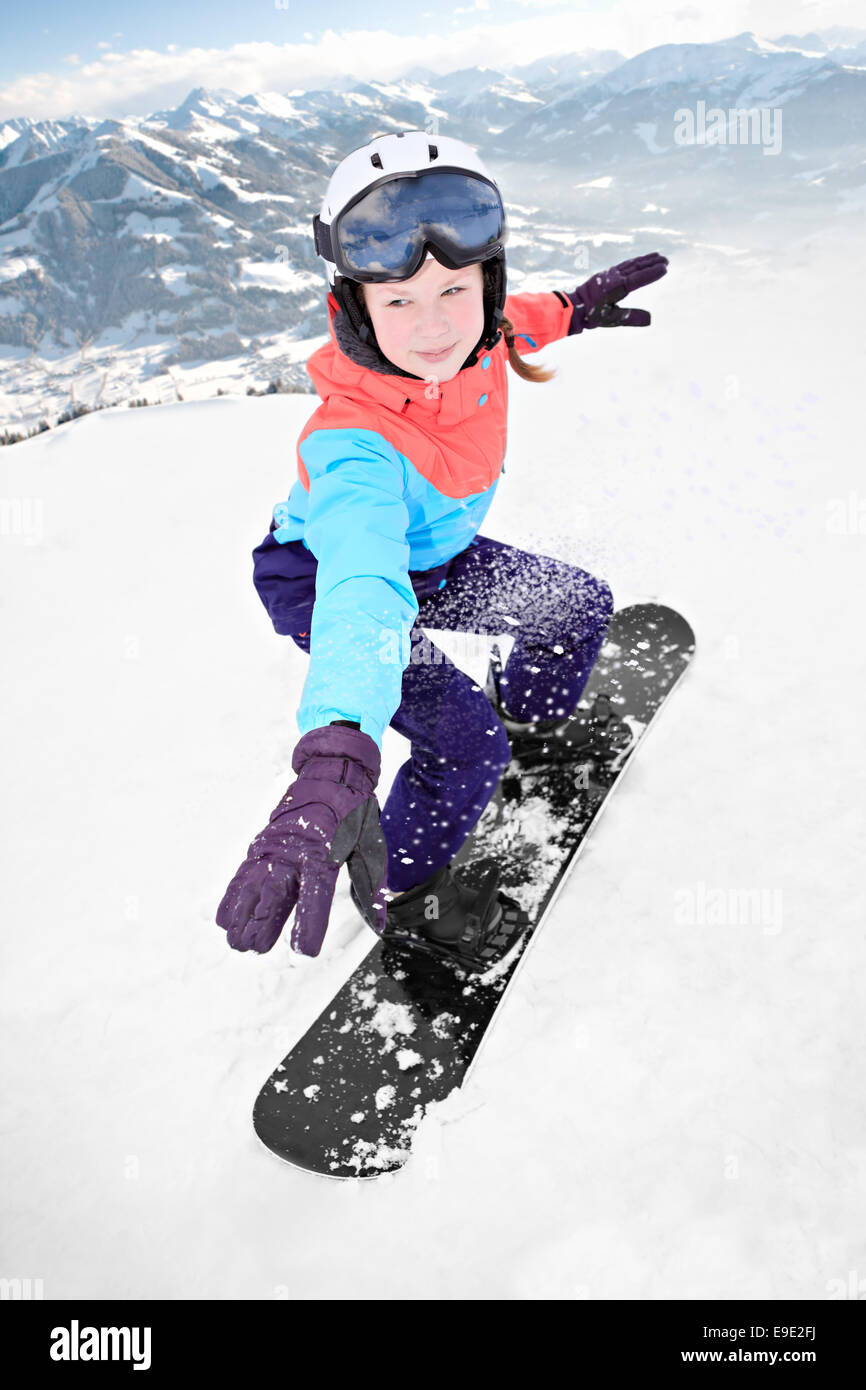 a teenage girl snowboarding in the Alps Stock Photo - Alamy