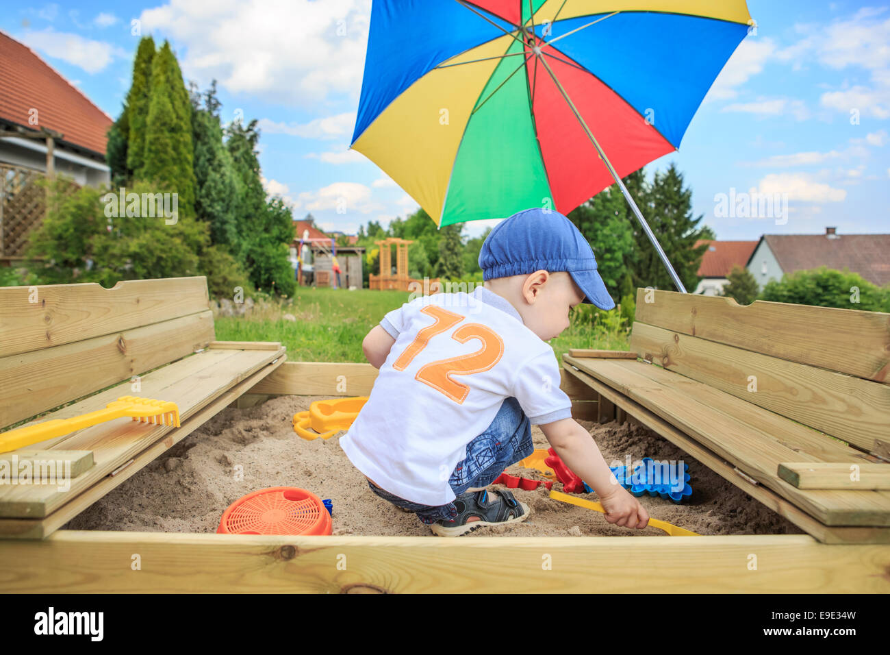 little male child playing in the sandbox Stock Photo - Alamy