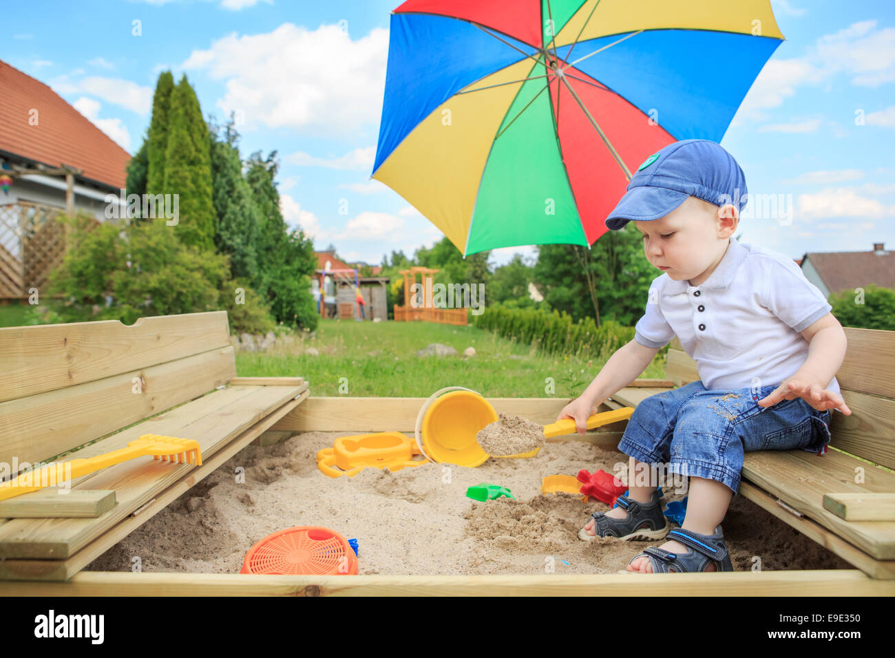 little male child playing in the sandbox Stock Photo - Alamy