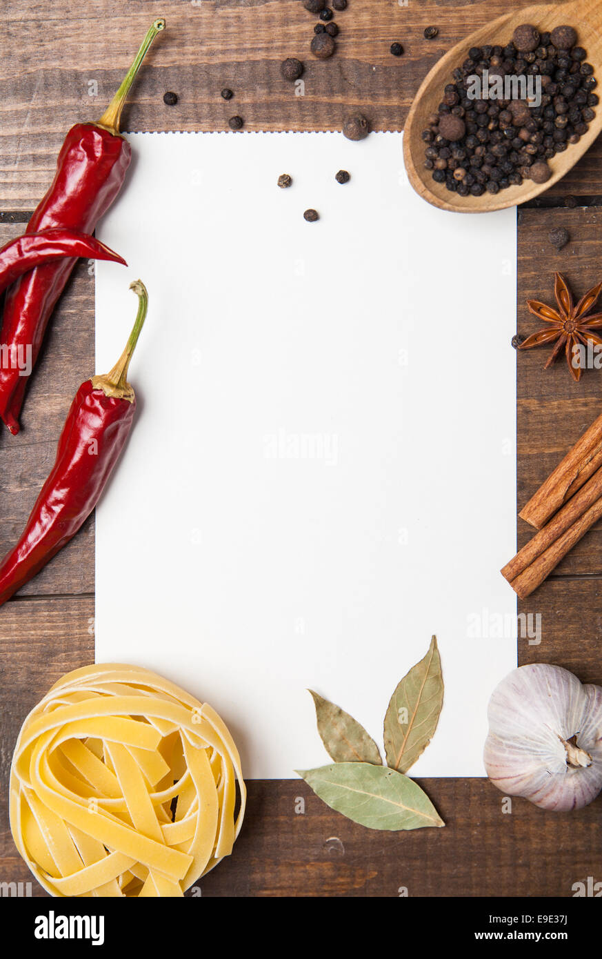 blank paper for recipes with ingredients, pasta, pepper and spices on ...