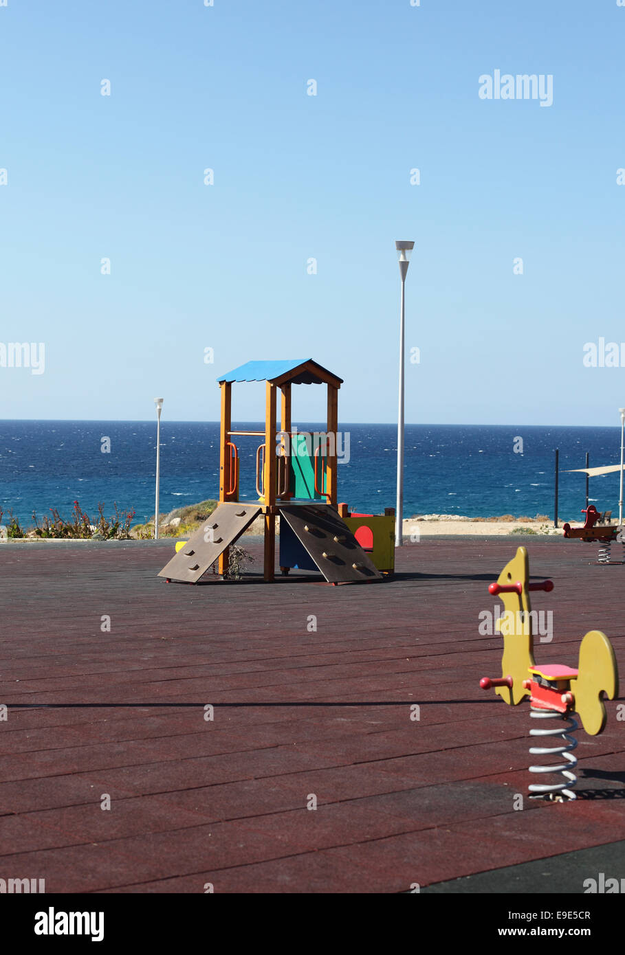 Sunny playground by the sea Stock Photo - Alamy