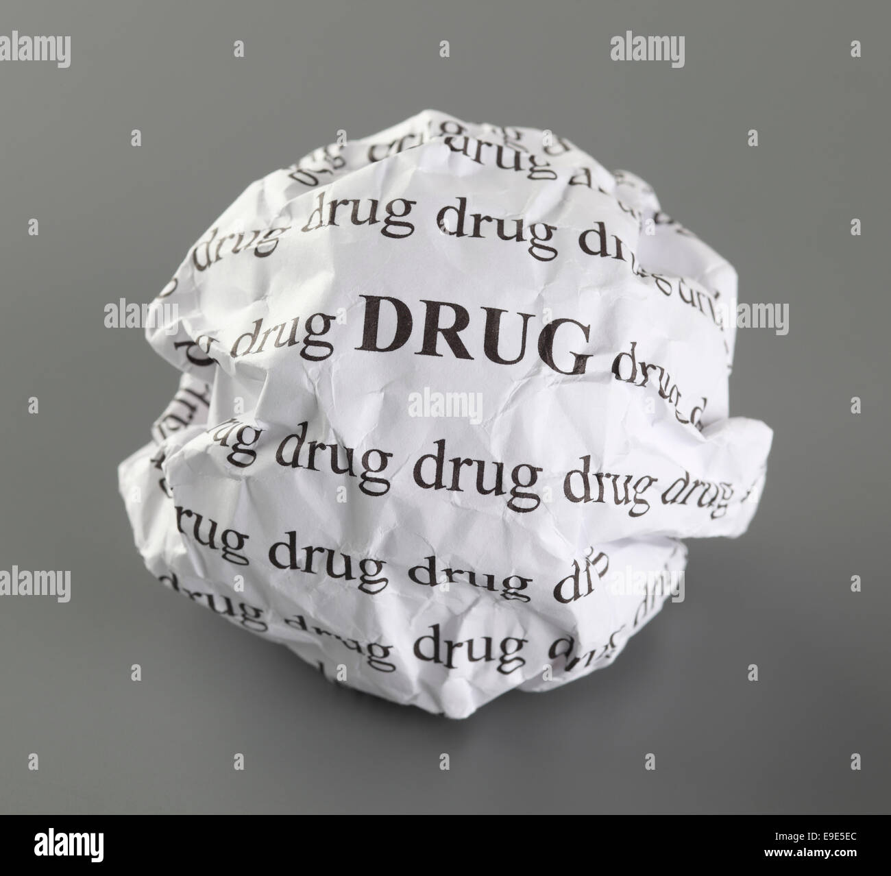Crumpled paper ball with words "Drug" on gray background Stock Photo ...