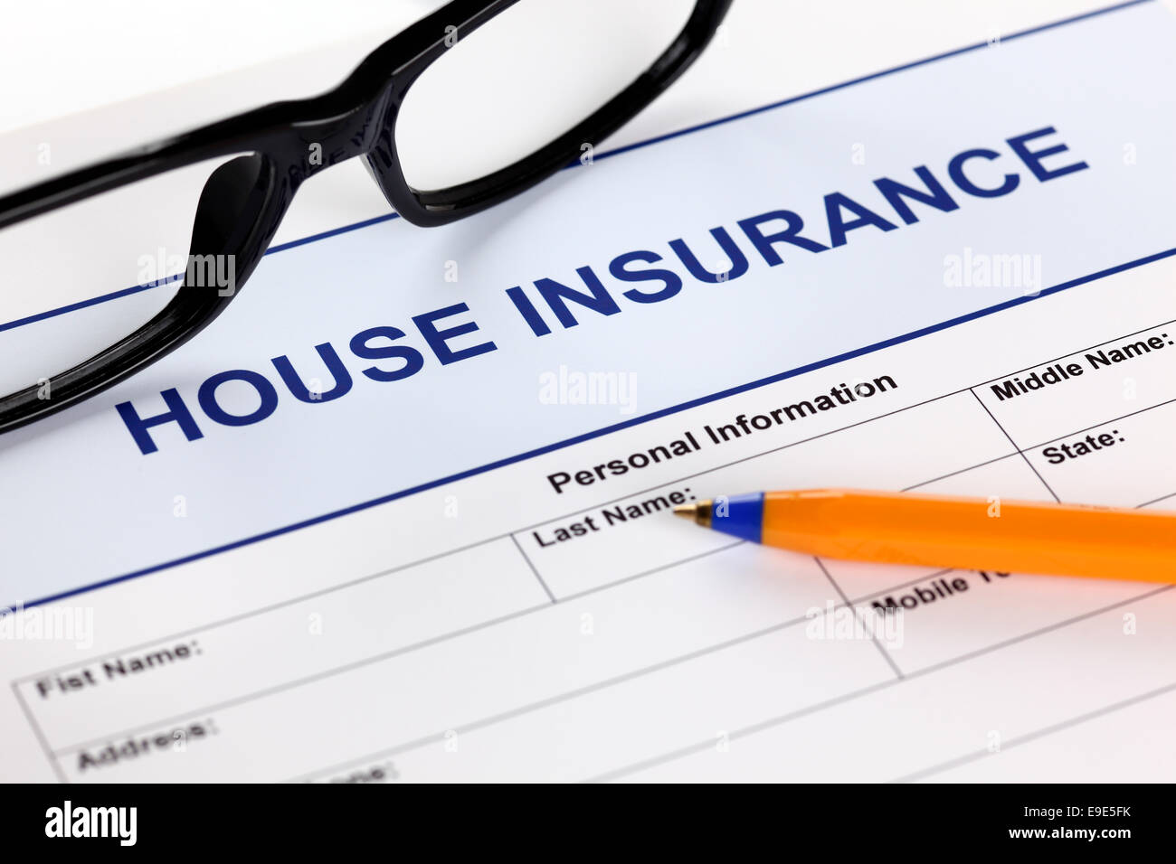 House insurance application form with glasses and ballpoint pen Stock ...