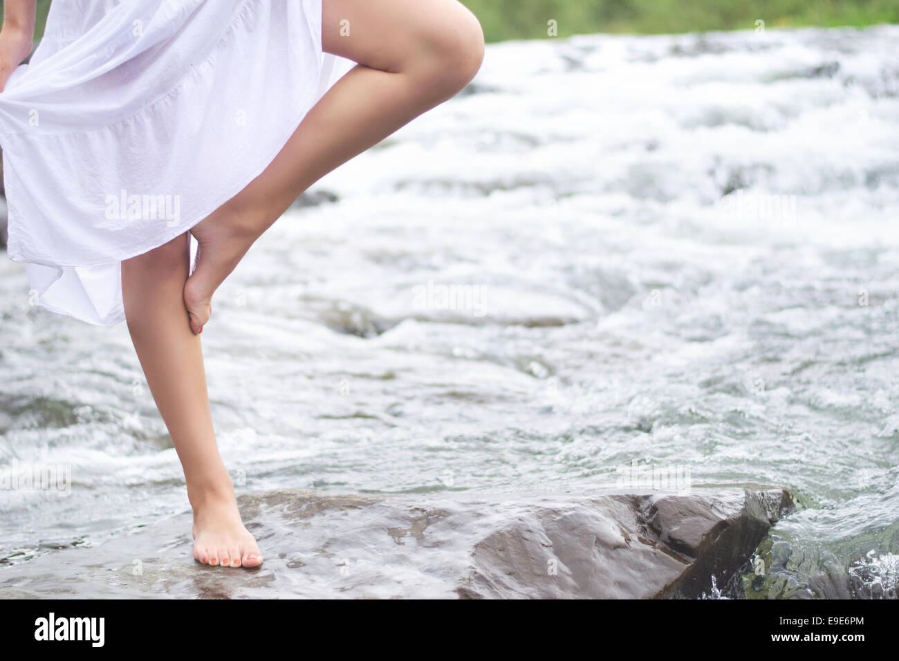 Girl standing in the stream Stock Photo - Alamy
