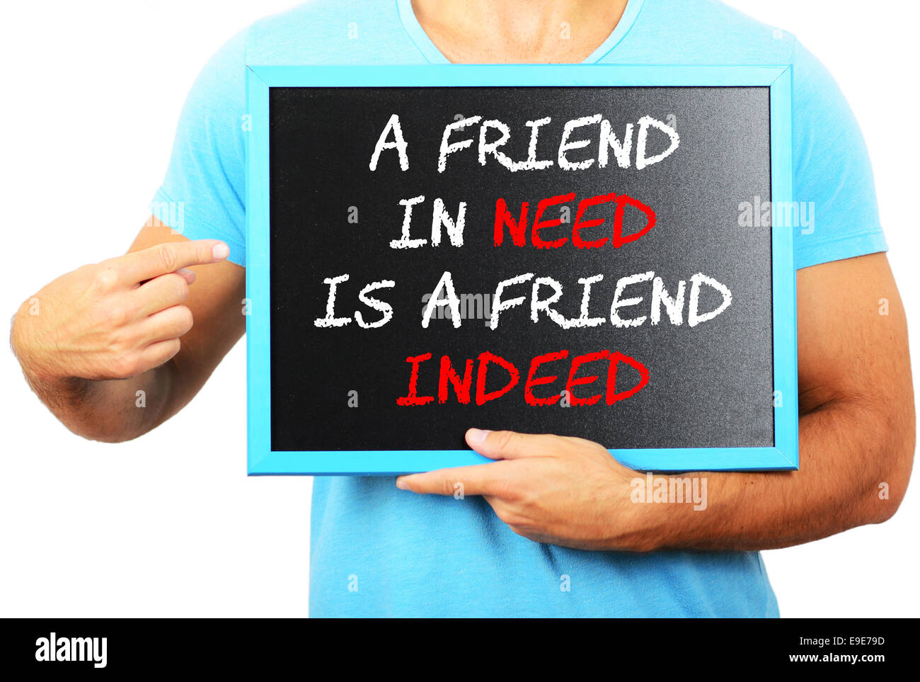 Man holding blackboard in hands and pointing the word A FRIEND IN NEED ...
