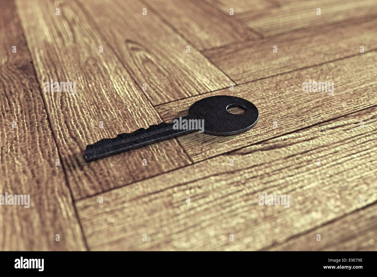 metal key on wooden floor Stock Photo - Alamy