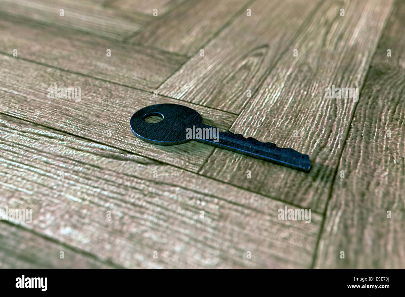 metal key on wooden floor Stock Photo - Alamy