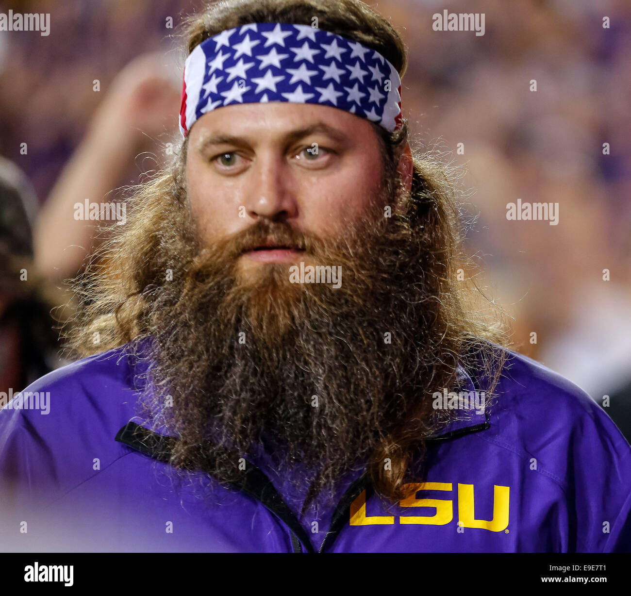 Duck Commander CEO Willie Robertson walking the LSU Tigers sidelines ...