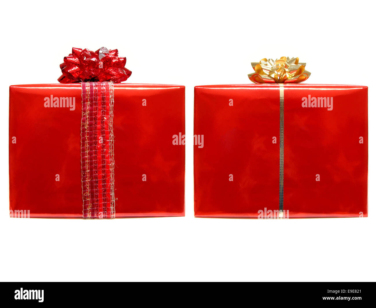 Two wrapped Christmas gift boxes with bows and ribbon isolated on white ...