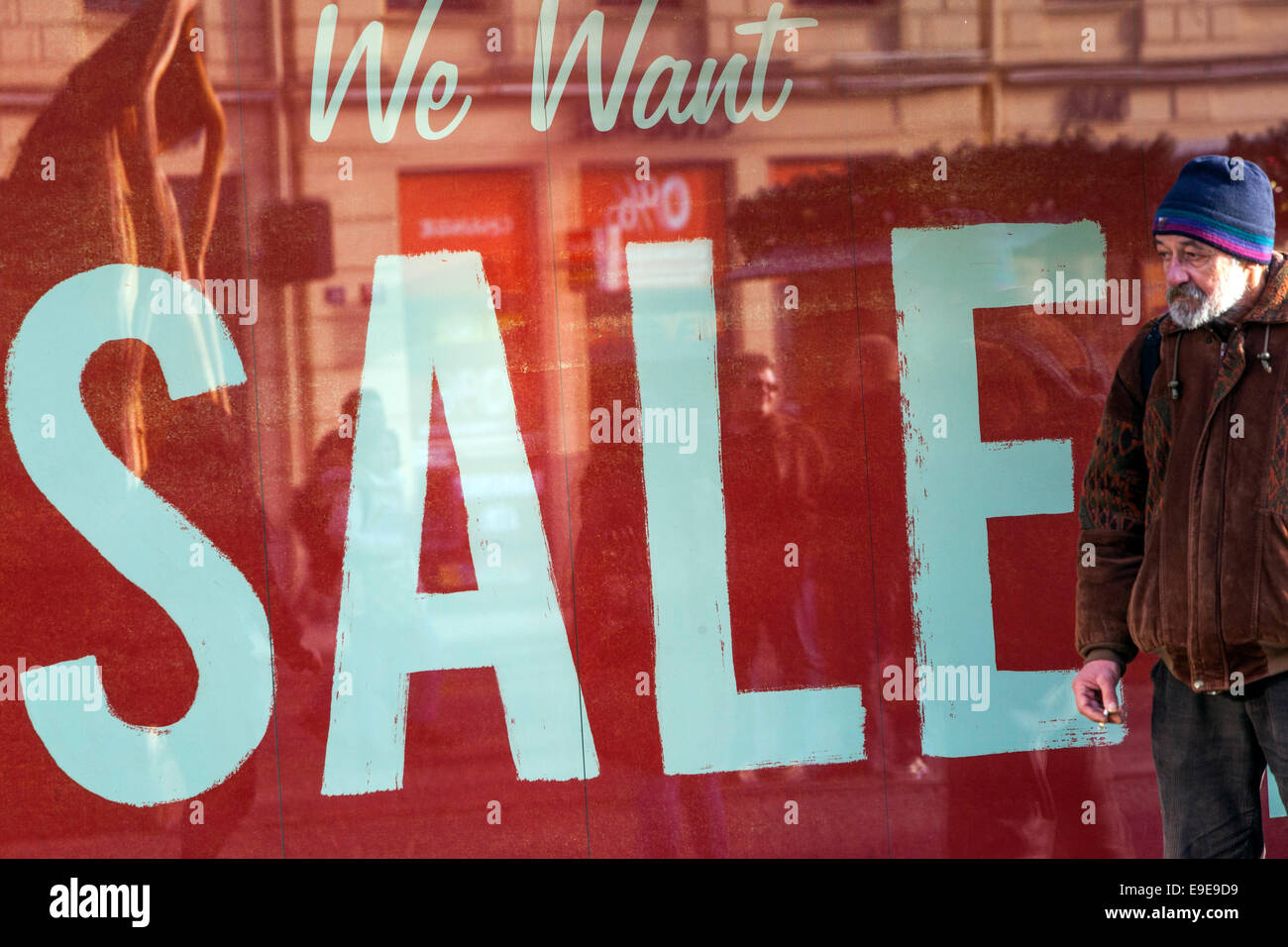 Sale signs in shop window display Stock Photo - Alamy