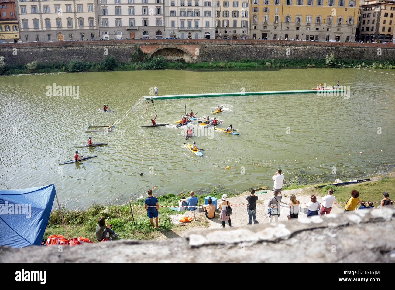 spectators on both sides of Arno river watch tense moment in kayak polo ...