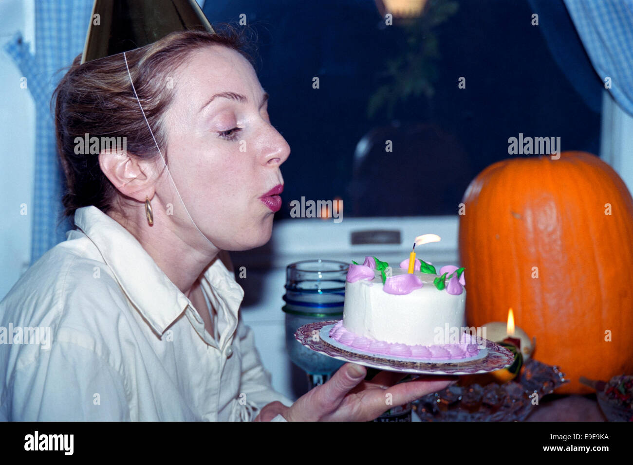 Woman blowing candle out, not birthday hi-res stock photography and ...