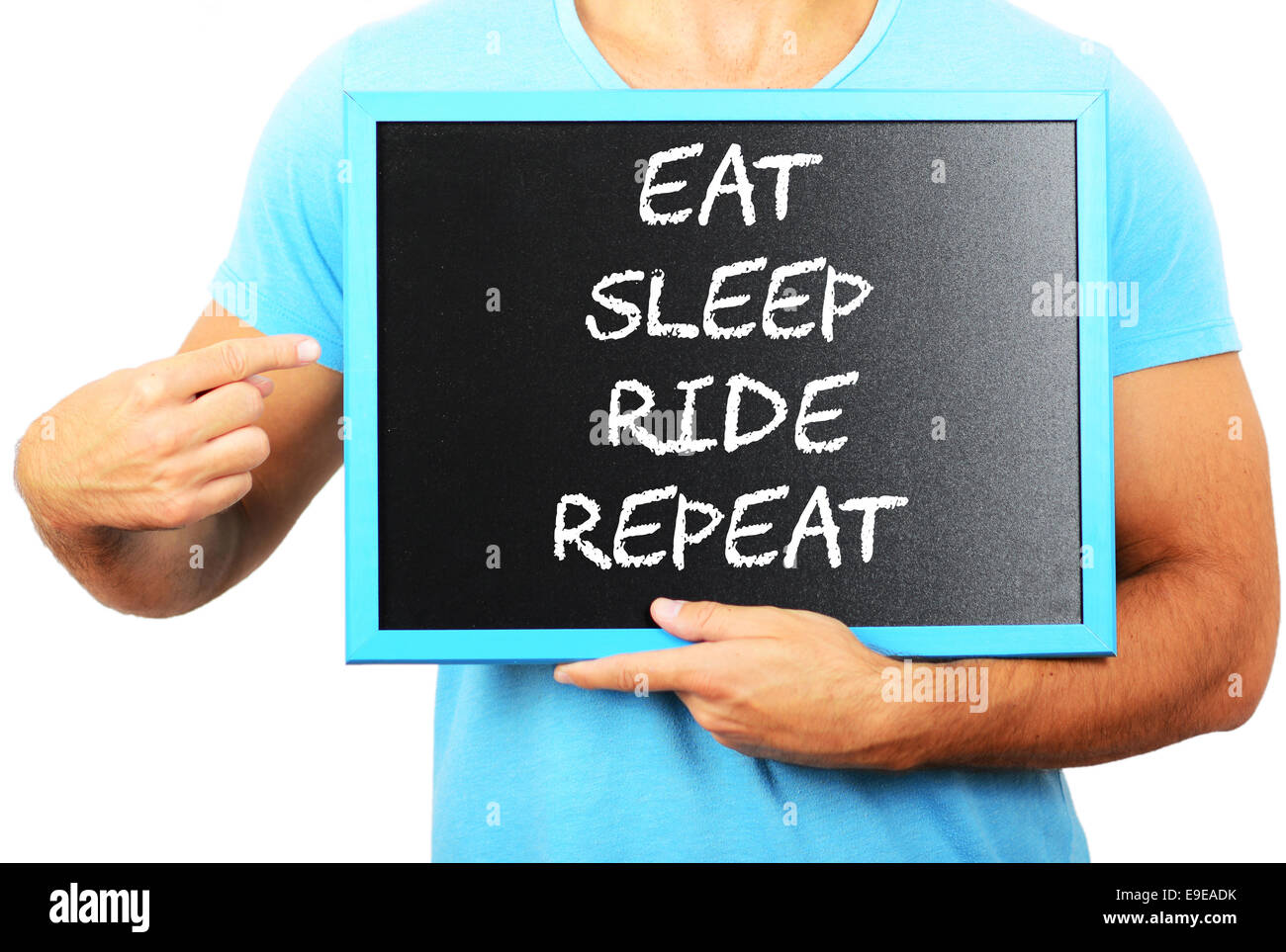 Man holding blackboard in hands and pointing the word EAT SLEEP RIDE ...