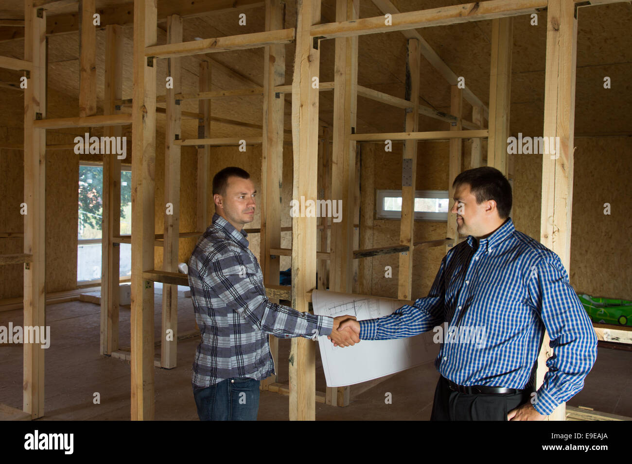 Male Engineer and Architect Showing Handshake at Building Site ...
