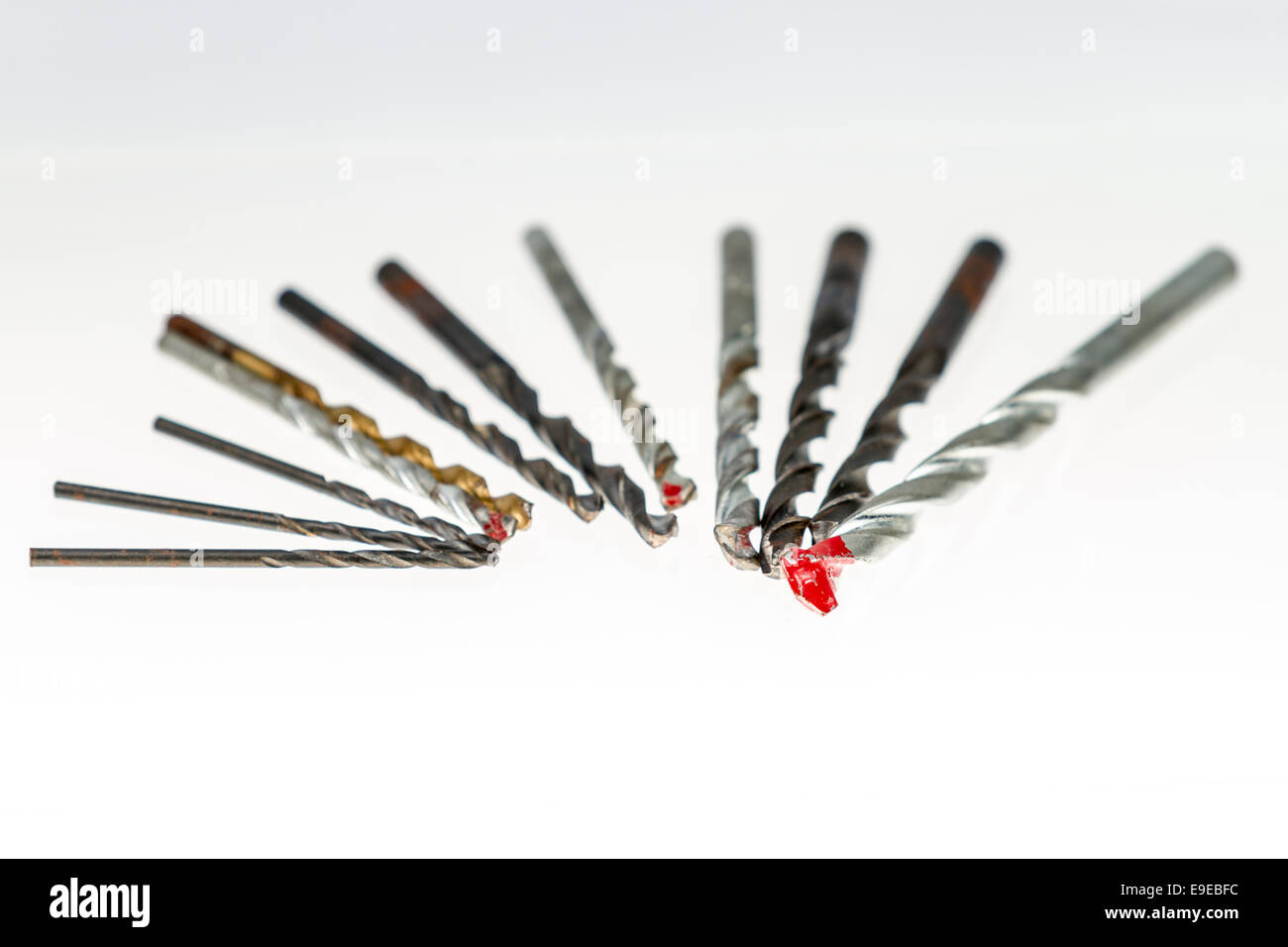 Assorted drill bits on isolated white background Stock Photo - Alamy