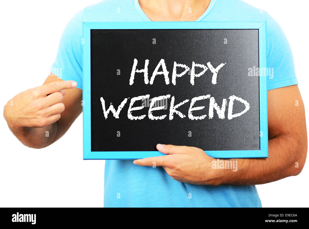 Man holding blackboard in hands and pointing the word HAPPY WEEKEND ...