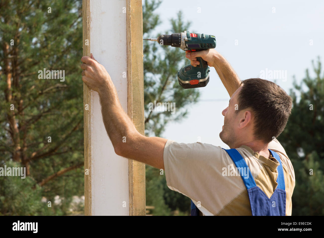 Close up Male Construction Worker Drilling on Wooden Plank During ...