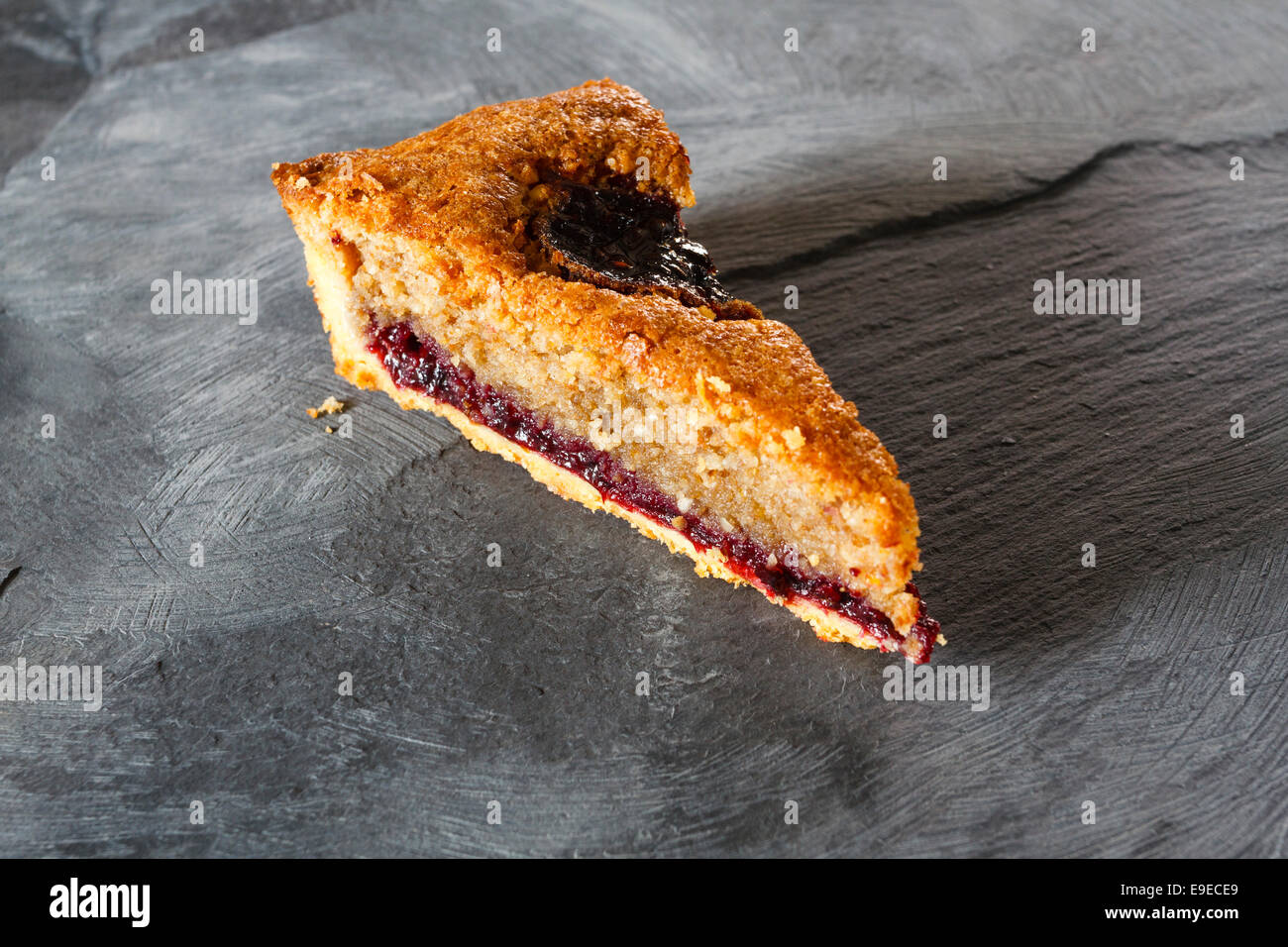 Homemade Bakewell tart slice, tart made using mixed berries and ...