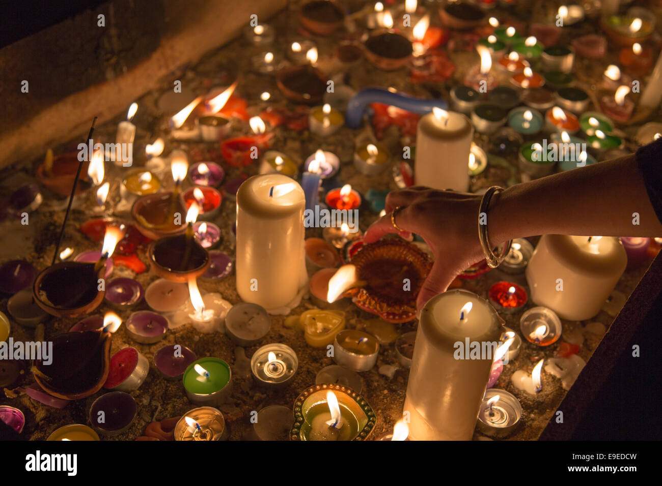 Sikhs lighting Divali candles outside the Gurdwara Stock Photo - Alamy