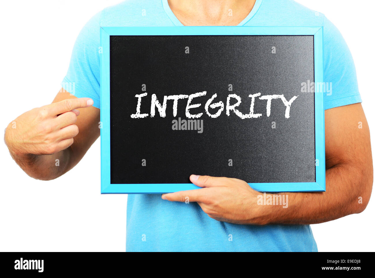Man holding blackboard in hands and pointing the word INTEGRITY Stock ...