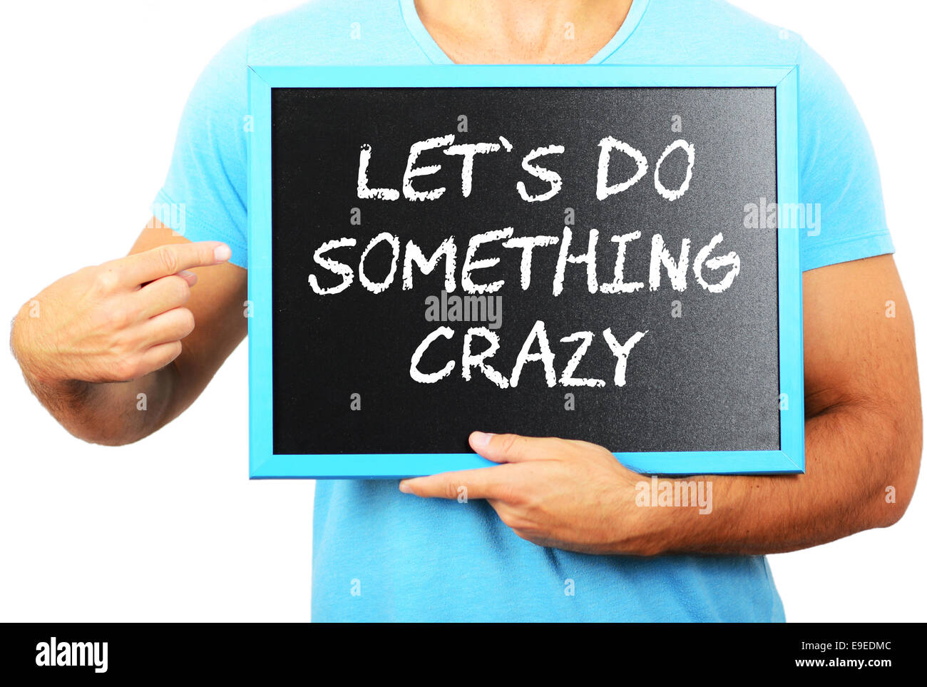 Man holding blackboard in hands and pointing the word LET'S DO ...