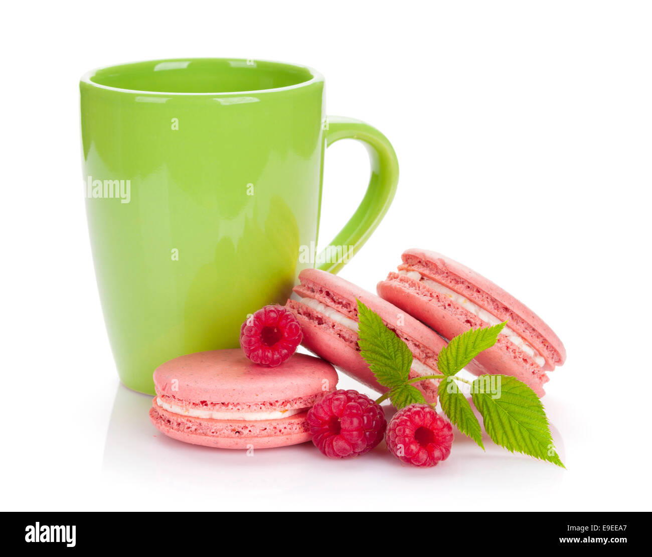 Pink raspberry macaroon cookies and cup of drink. Isolated on white ...