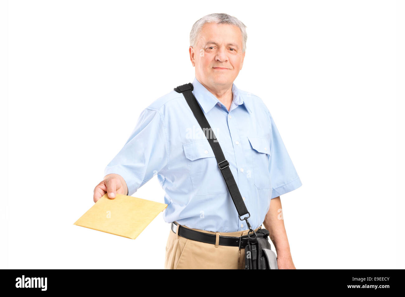 Mailman handing an envelope towards the camera isolated on white ...