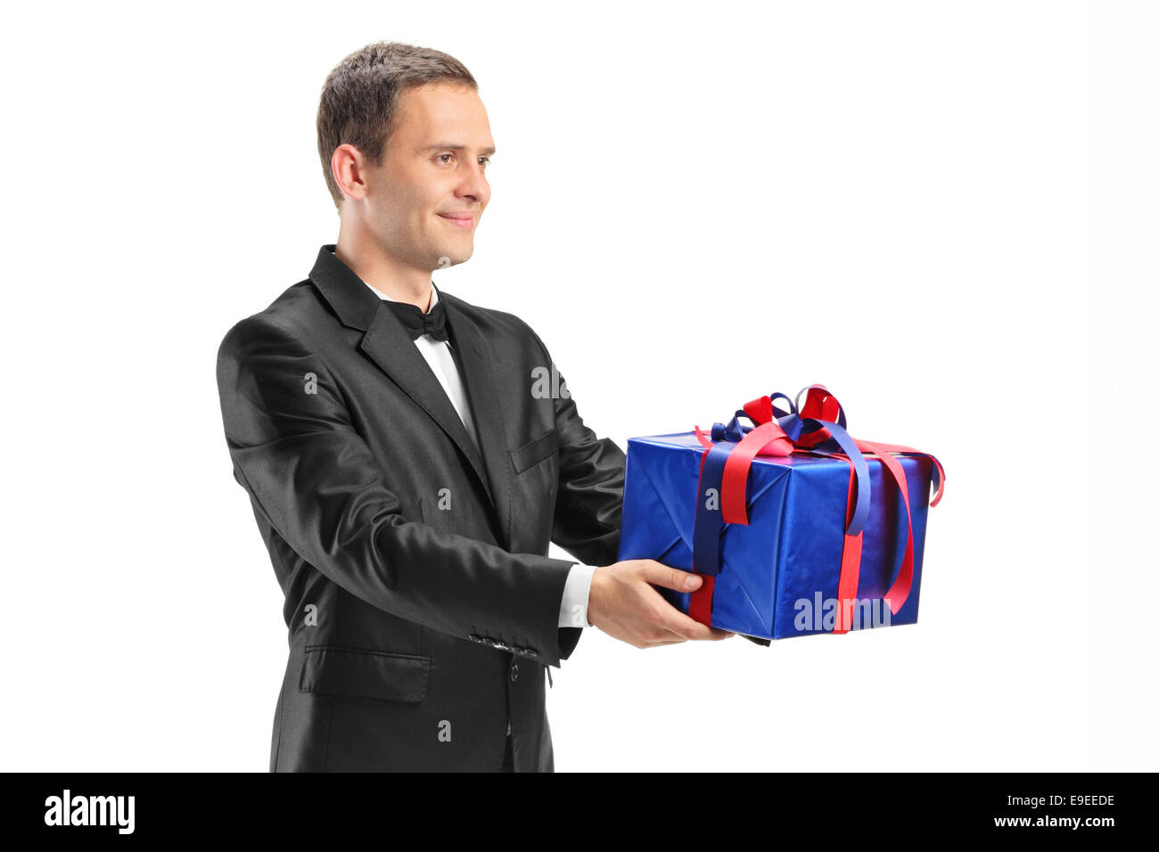 Young guy holding a present Stock Photo - Alamy