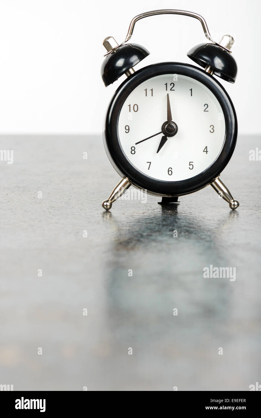 Black alarm clock Stock Photo - Alamy