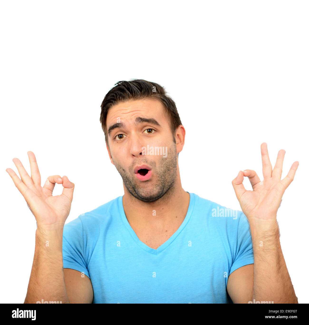 Portrait of funny man showing OK gesture with hands against white ...
