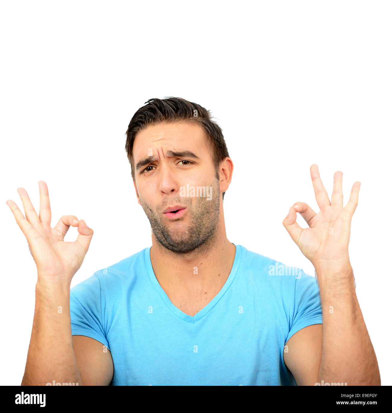 Portrait of funny man showing OK gesture with hands against white ...