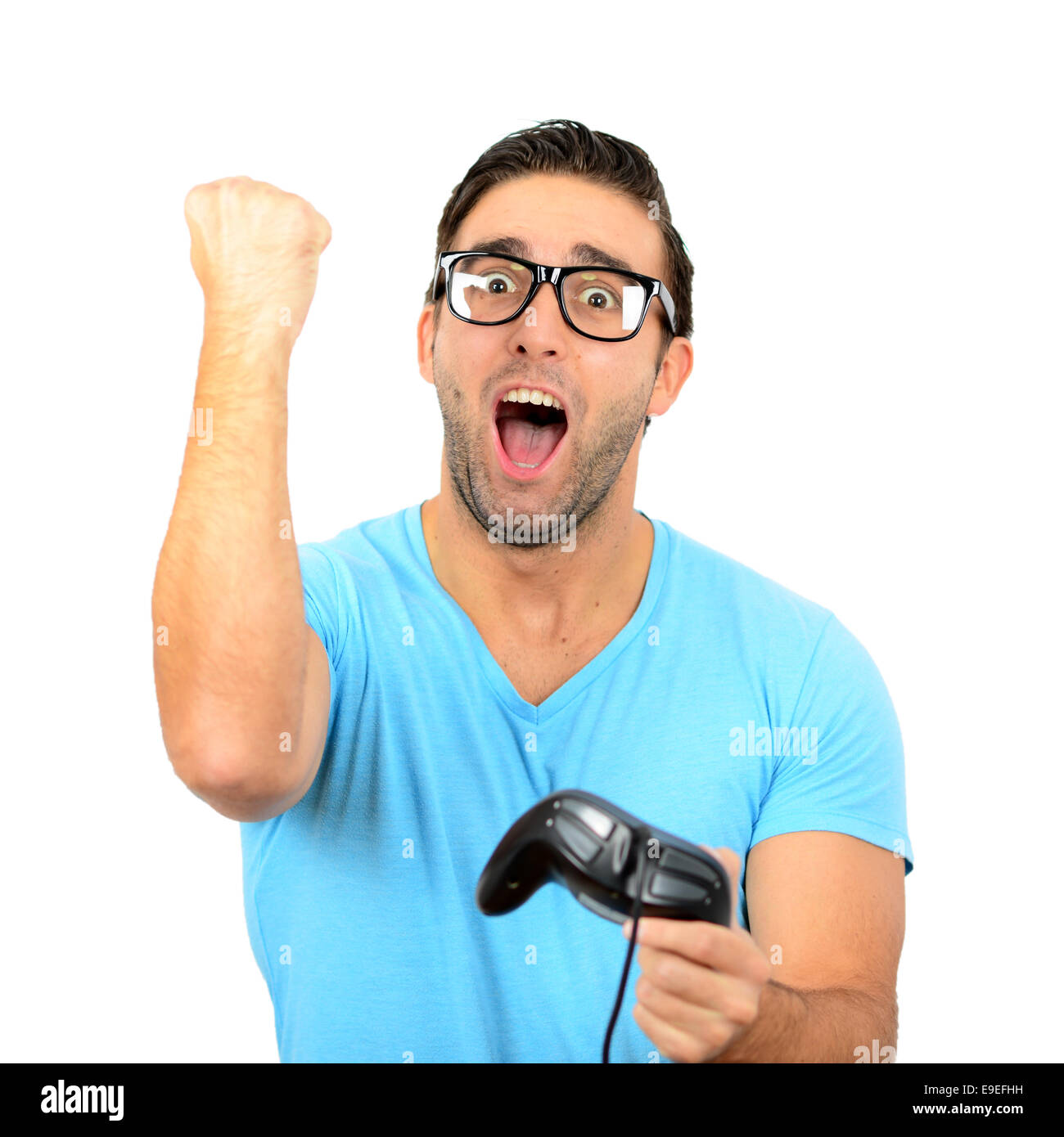 Portrait of handsome man holding joystick for video games against white ...
