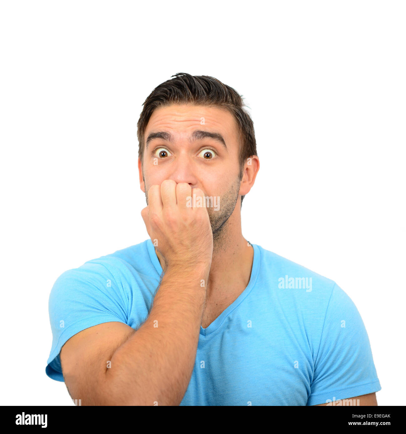 Portrait of man biting nails against white background Stock Photo - Alamy