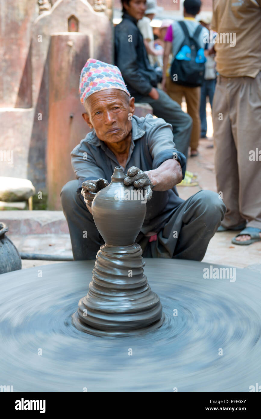 Unidentified pottery man on a small street near Bhaktapur durbar square ...