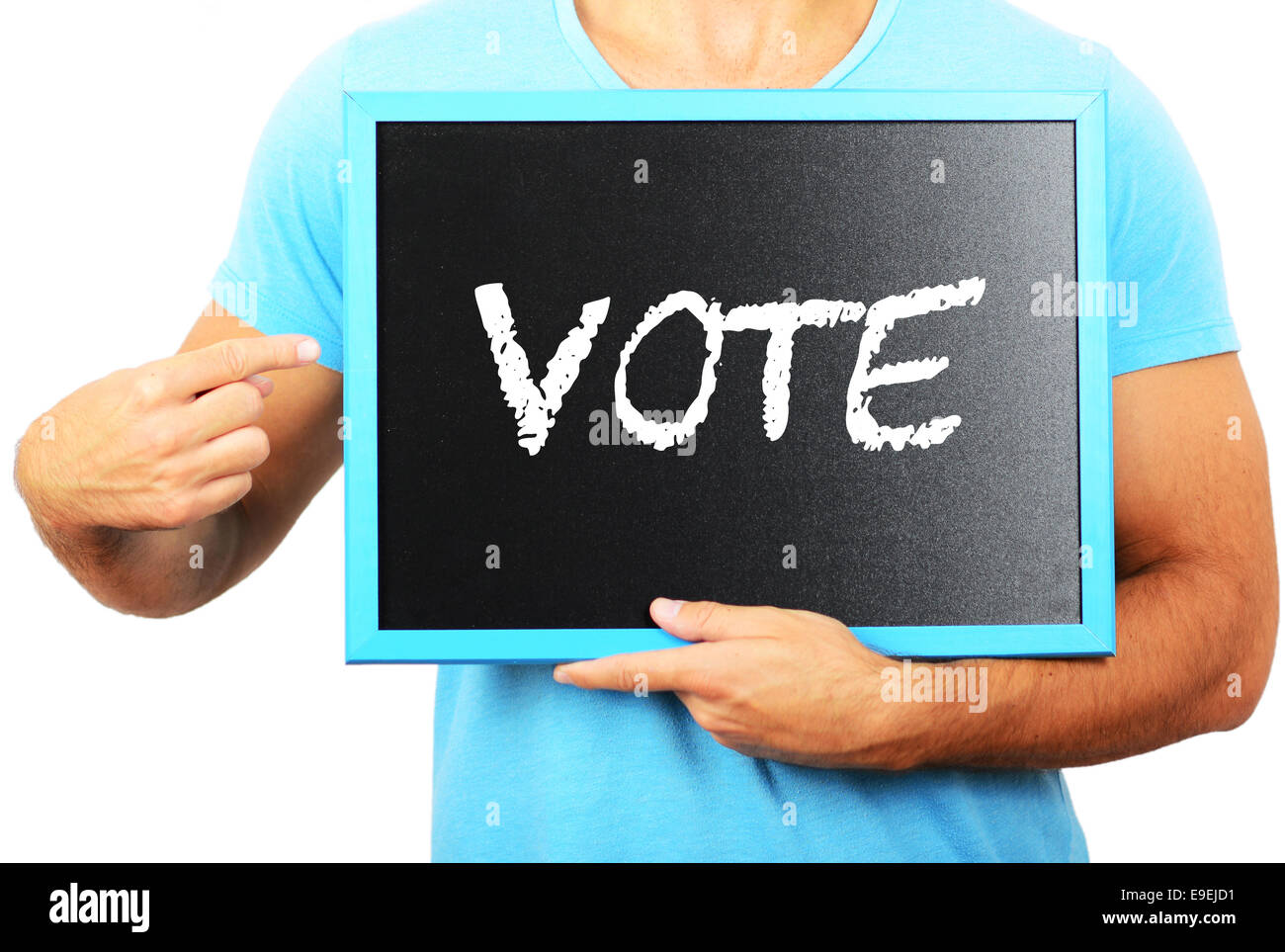 Man holding blackboard in hands and pointing the word VOTE Stock Photo ...