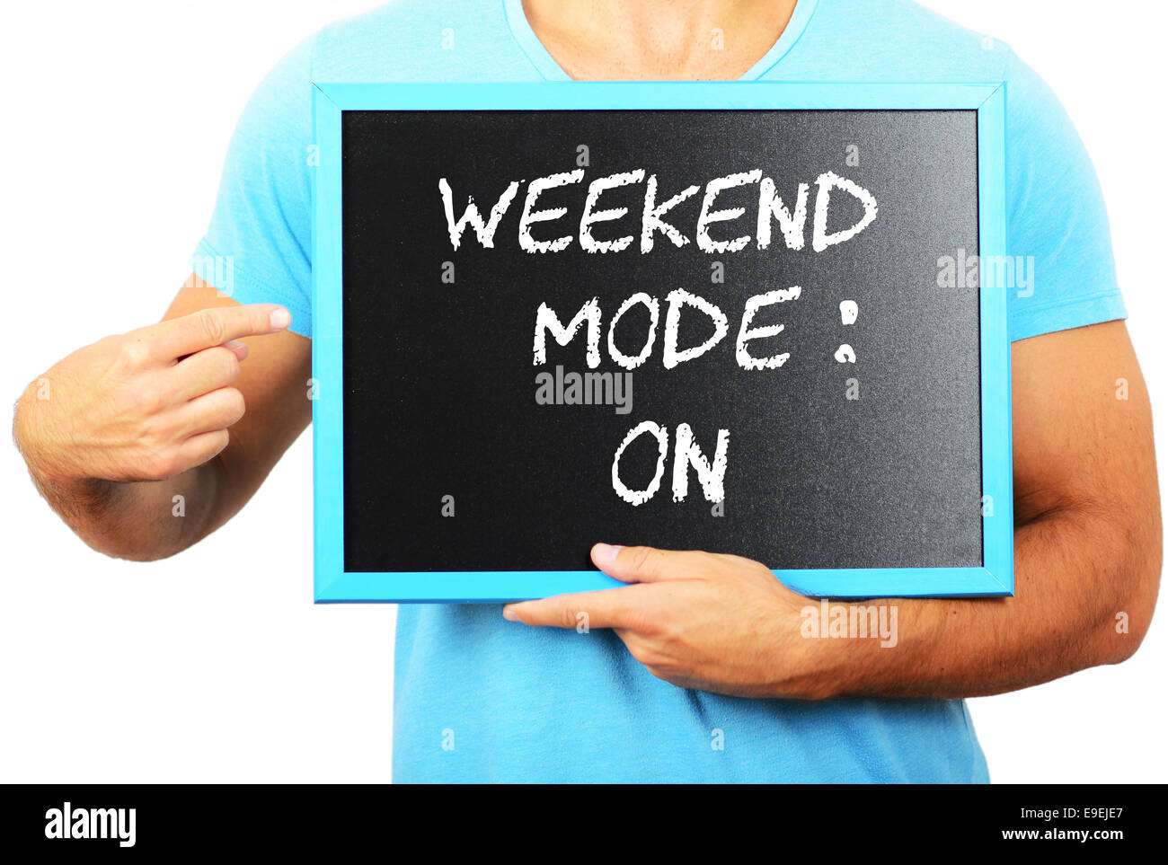 Man holding blackboard in hands and pointing the word WEEKEND MODE : ON ...