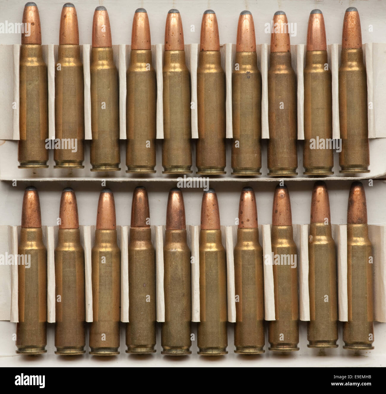 Closeup view of two rows of rifle ammunition Stock Photo - Alamy