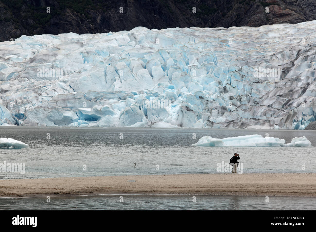 Photographer on sandbar at Mendenhall Lake photographing Mendenhall ...