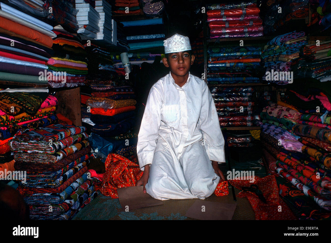 Young textile trader in Muttrah souq, Oman taken in 1975 Stock Photo ...