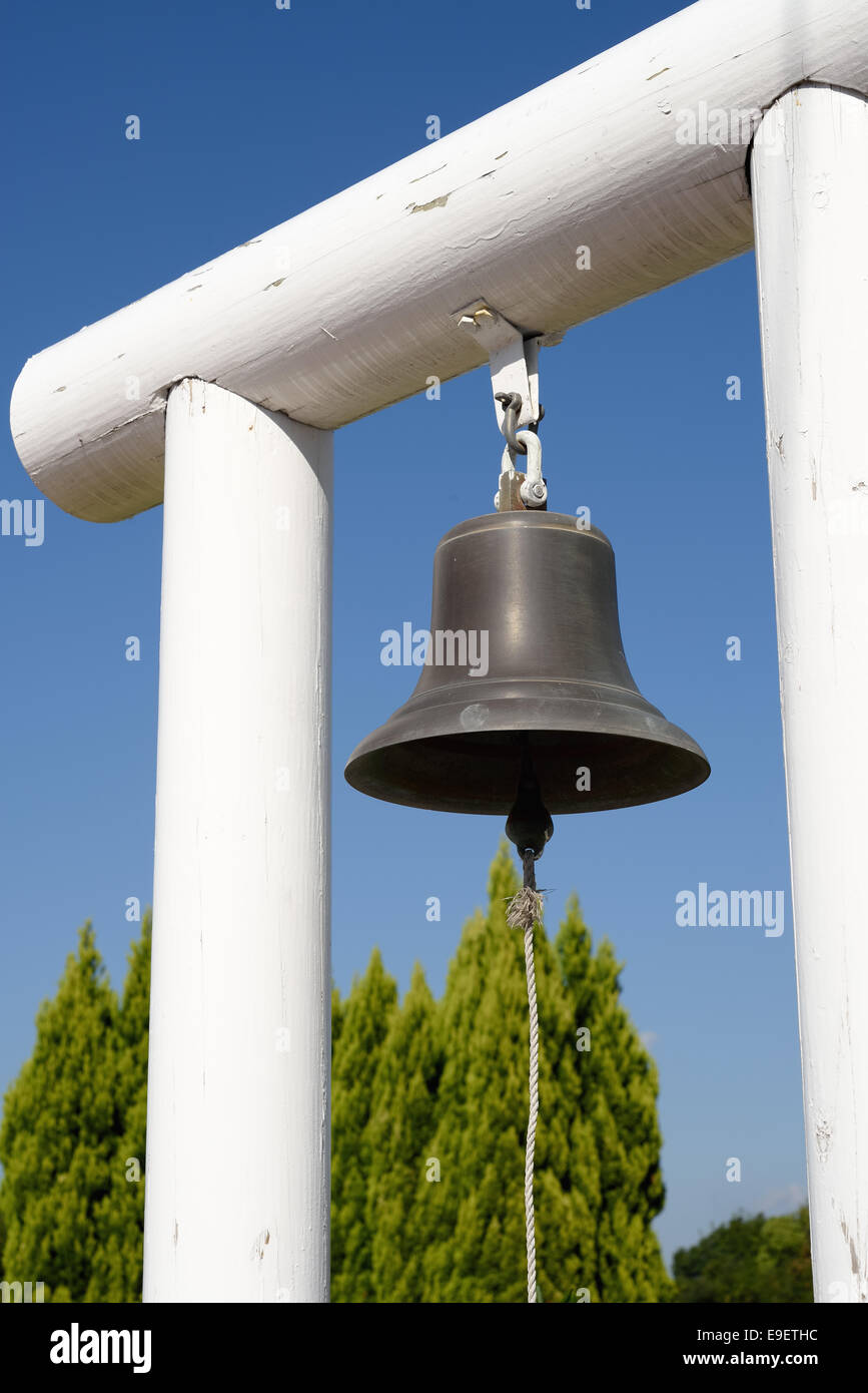 Bronze bell hanging on wooden pillar Stock Photo - Alamy