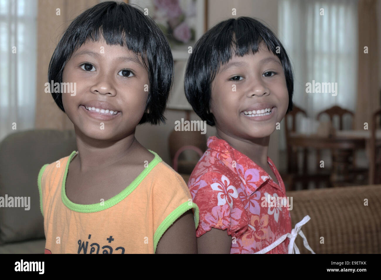 Twins. Identical twin Thai 6 year old sisters. Thailand children S. E ...