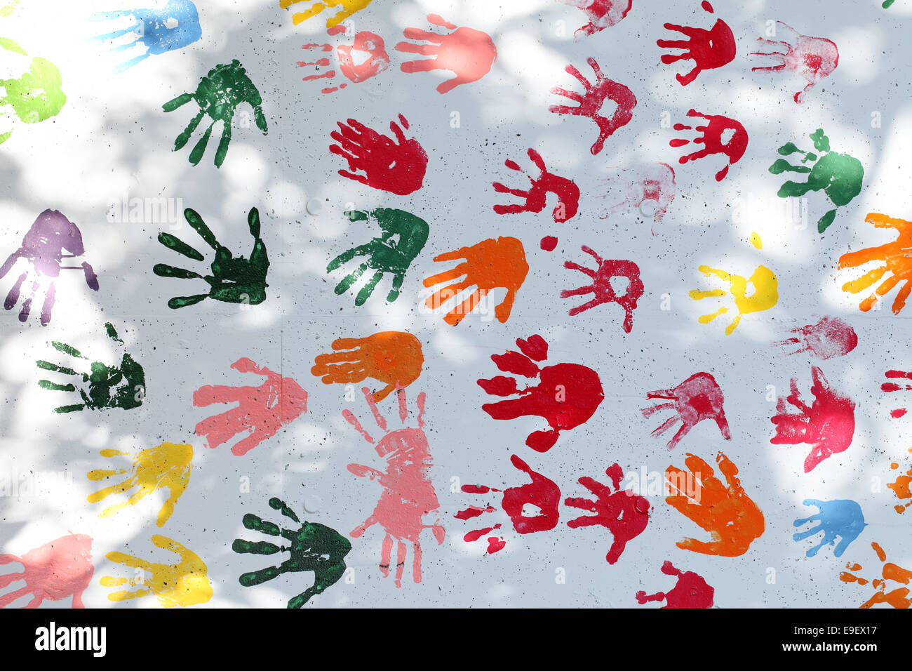 colorful hand prints on white wall background Stock Photo - Alamy
