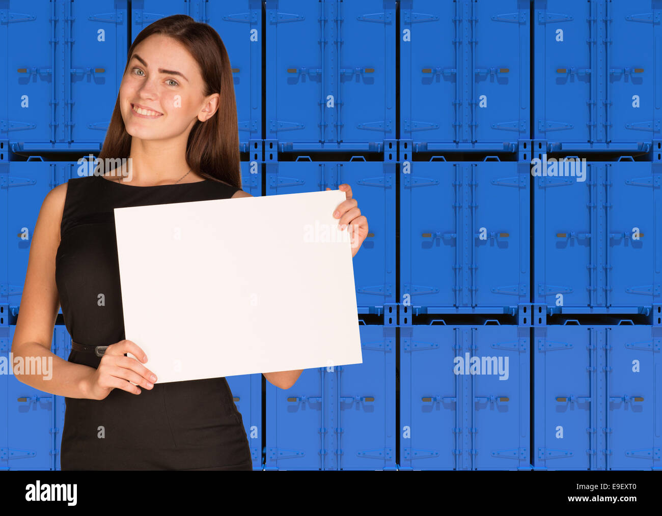 Businesswoman hold paper sheet. Wall of blue containers Stock Photo - Alamy
