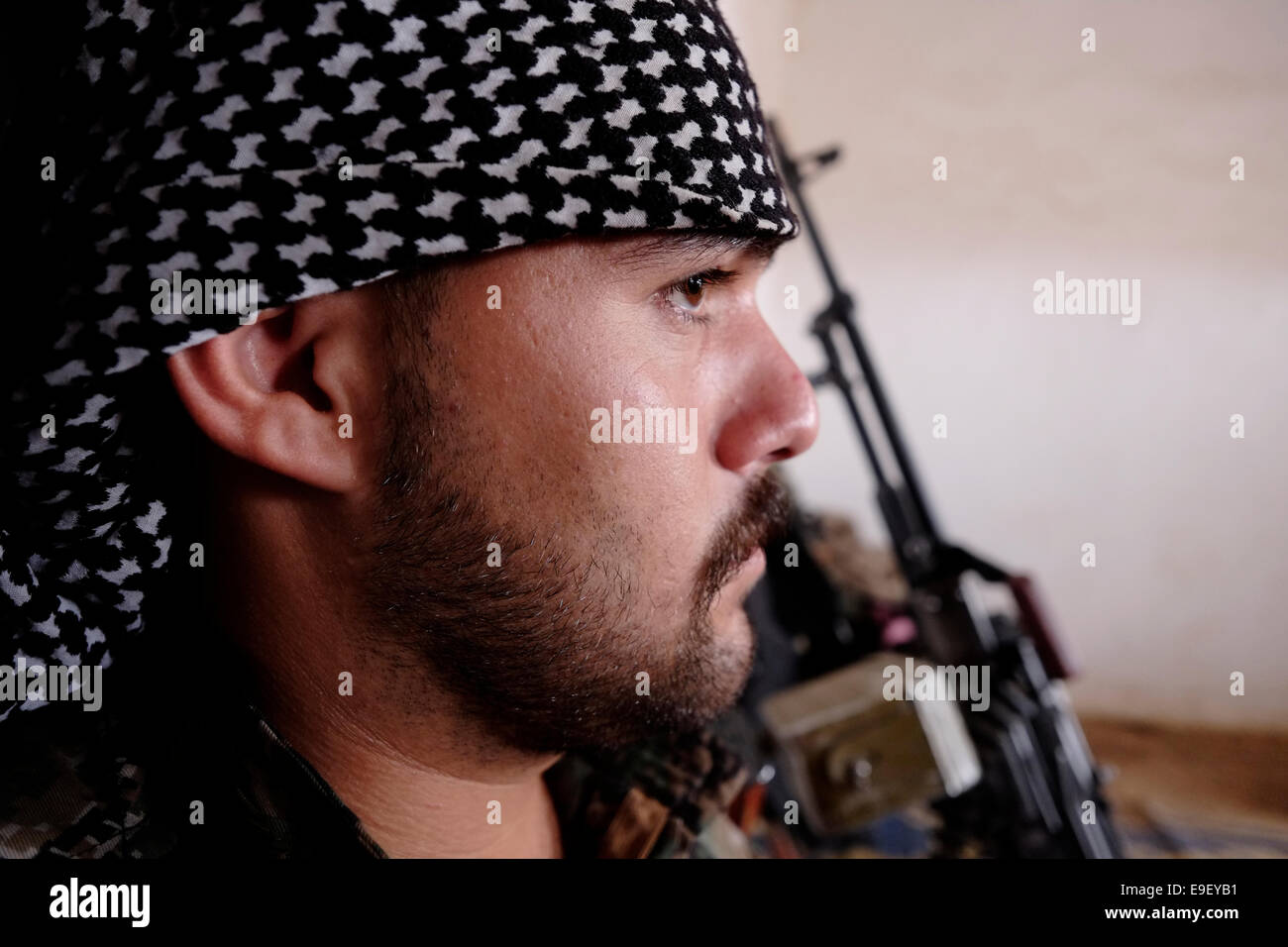 A Kurdish fighter of the People's Protection Units YPG wearing a ...